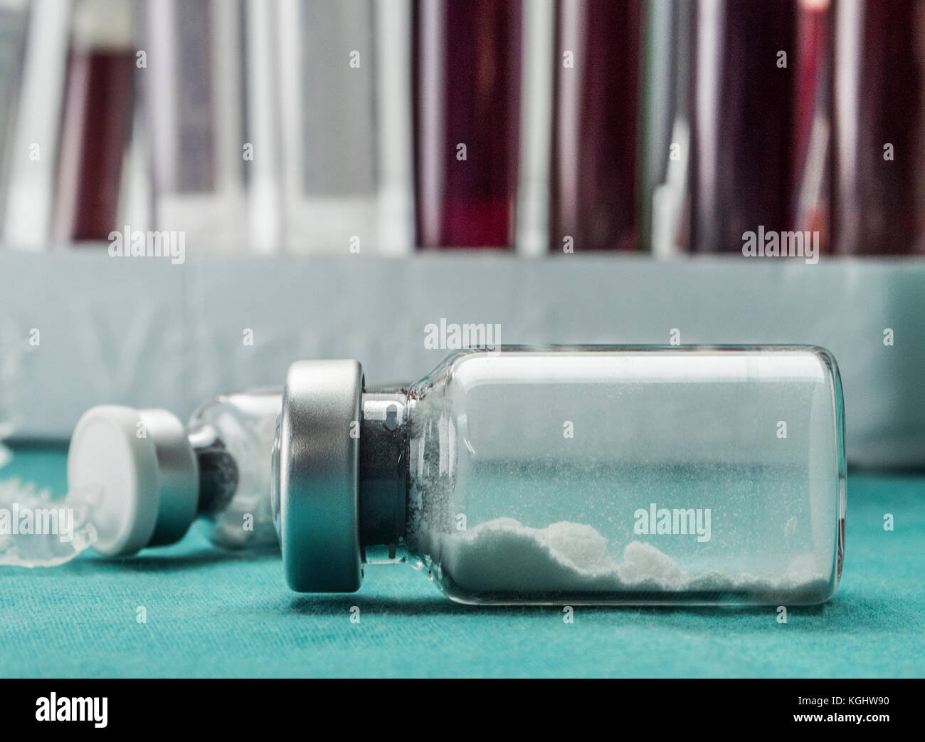 Transparent Vial with powdered medicine at a clinical laboratory table ...