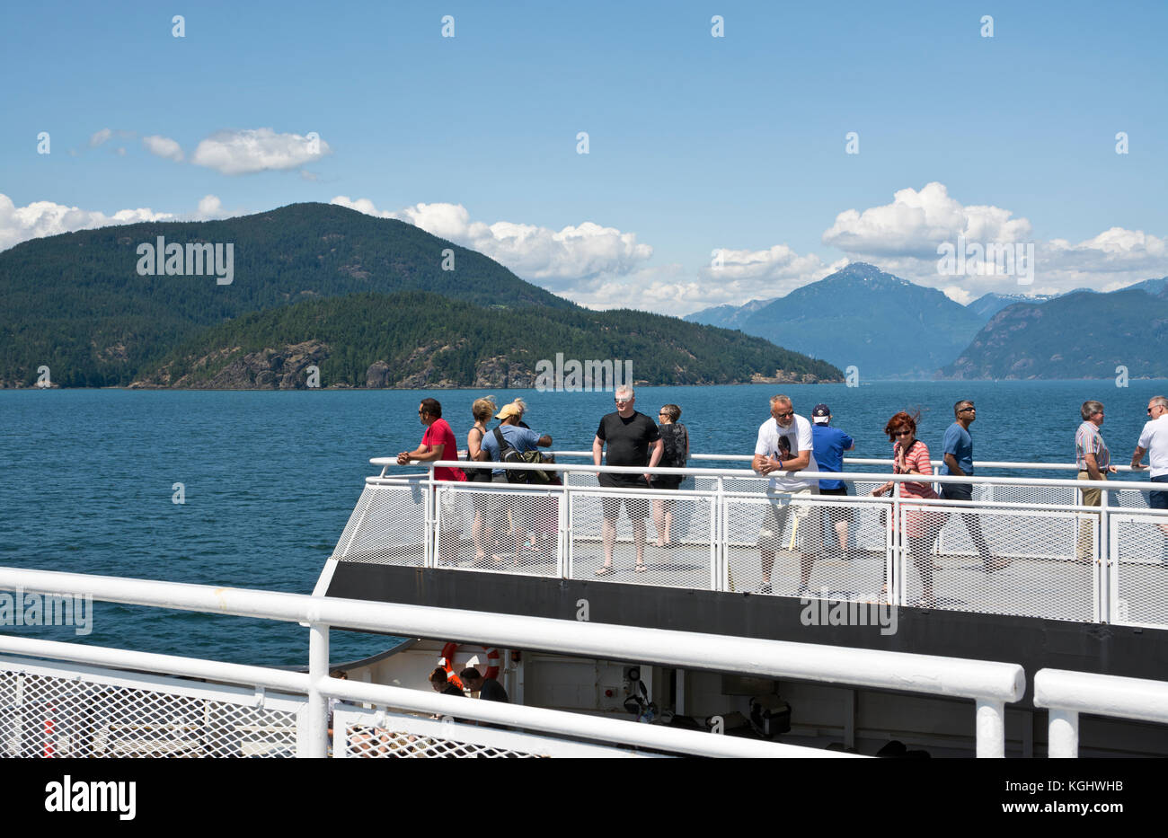Passengers on the outside deck of a BC Ferry ship travelling in Howe ...