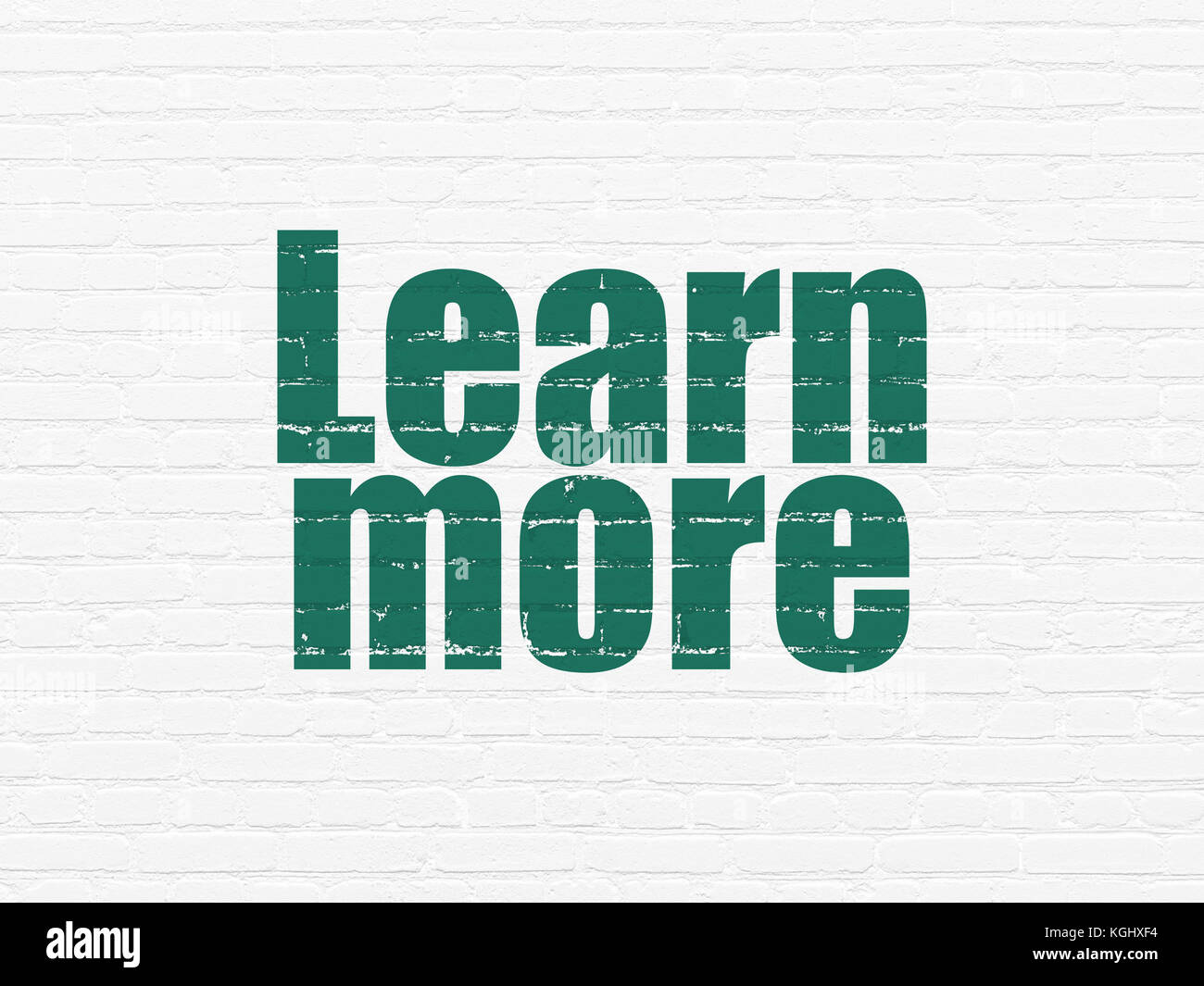 Learning concept: Learn More on wall background Stock Photo - Alamy