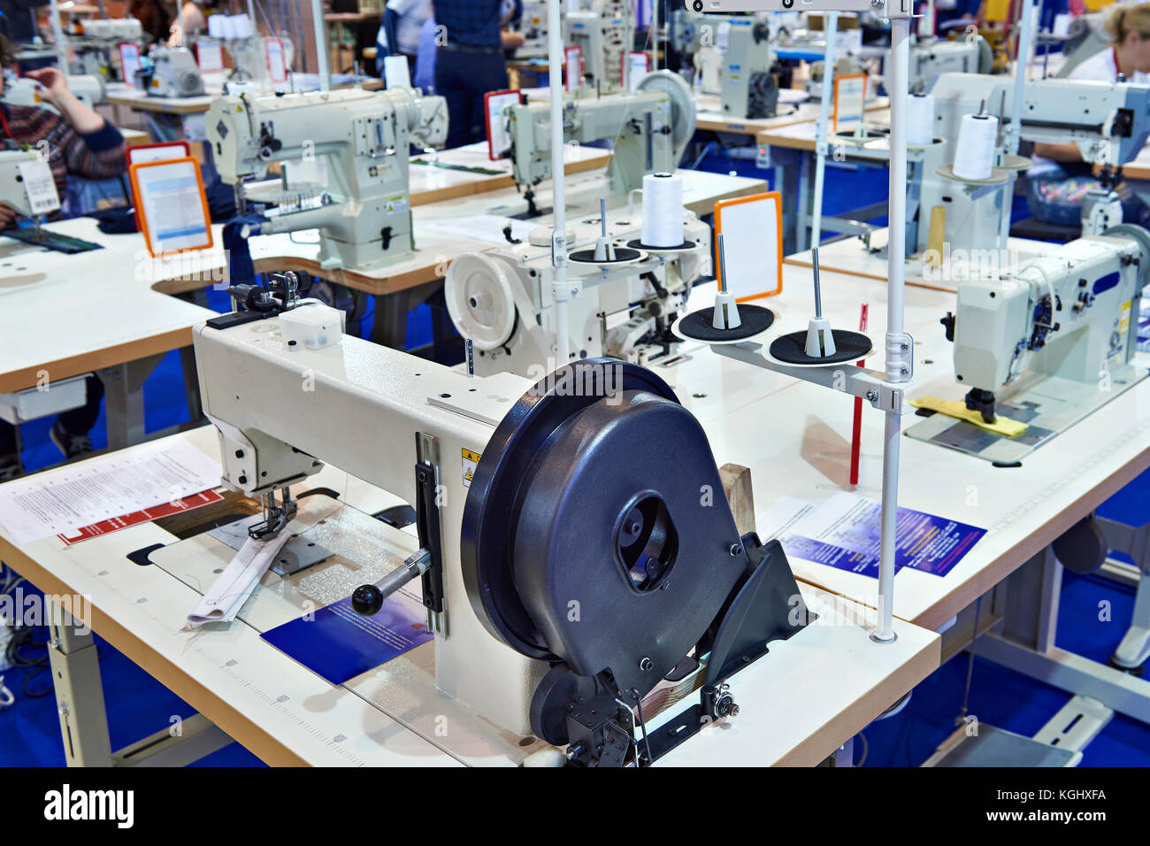 Sewing workshop with threads and electric sewing machines Stock Photo ...