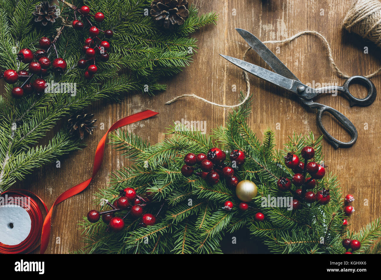 Christmas wreath with fir, berries and cones Stock Photo - Alamy