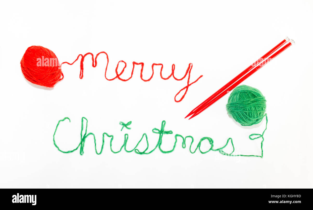 Merry Christmas written in cursive with red and green yarn and ...