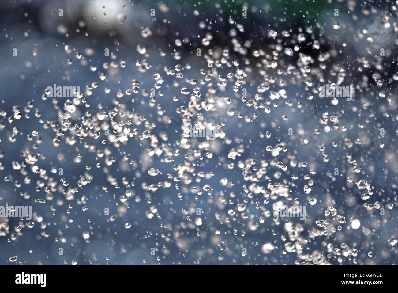 Flying rain drops in the air Stock Photo - Alamy