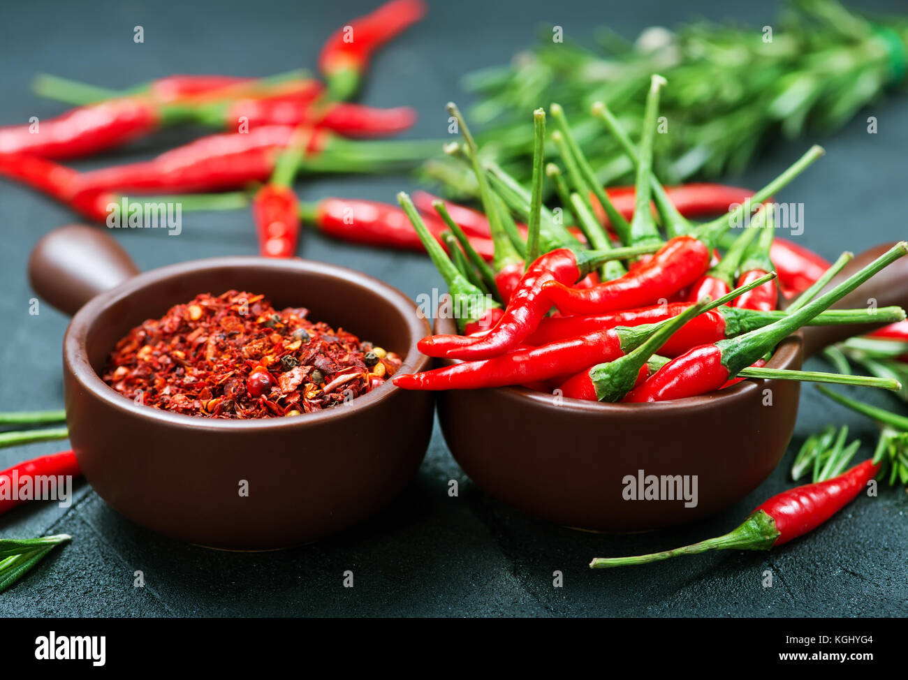 chilli peppers on the black table, chilli background Stock Photo - Alamy