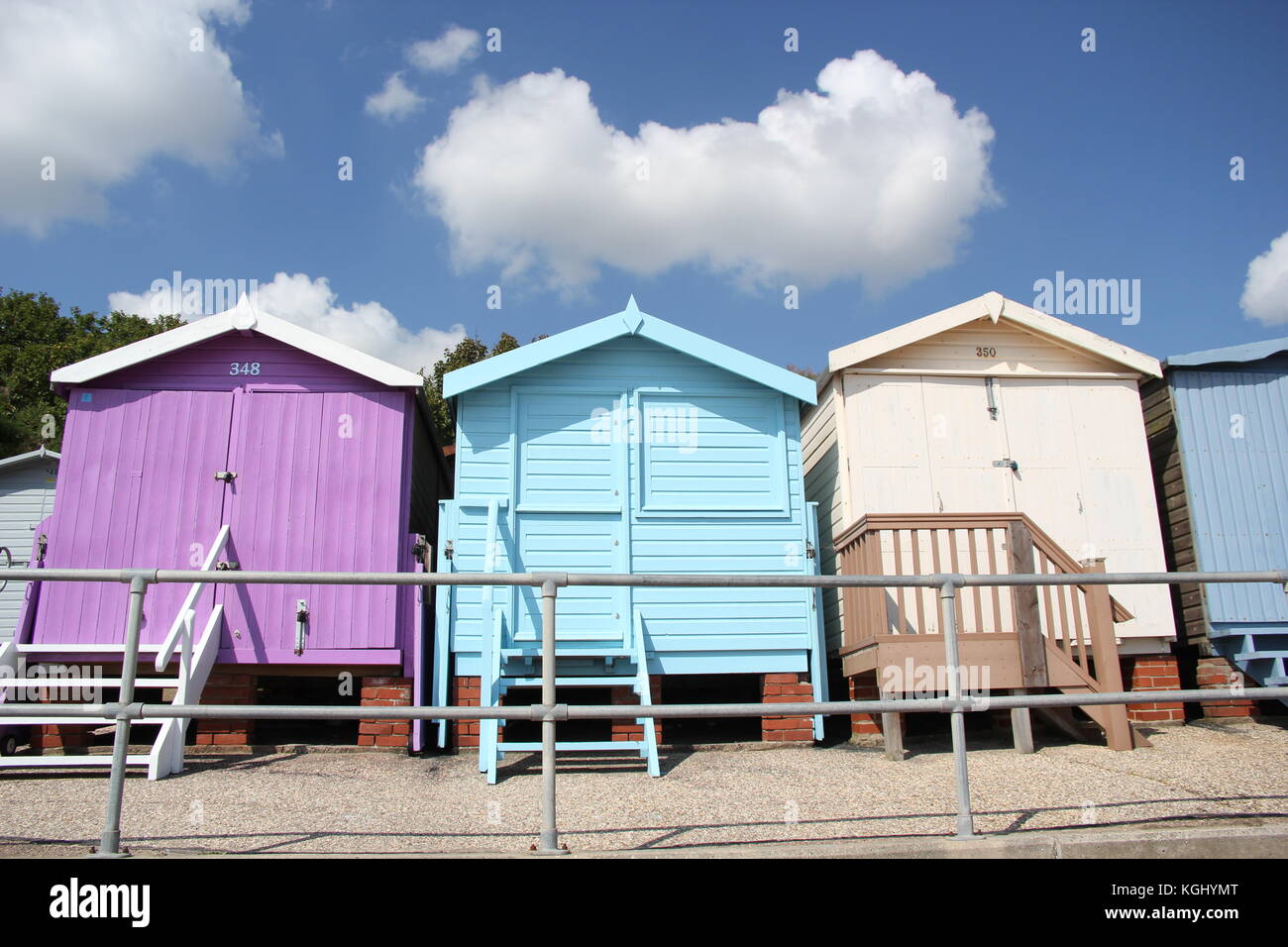 beach hut painted house paint on frinton beach Stock Photo - Alamy