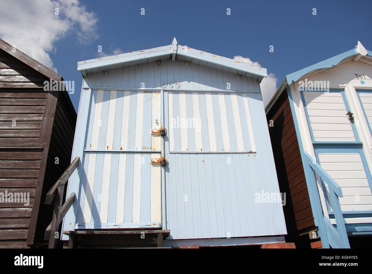 beach hut painted house paint on frinton beach Stock Photo - Alamy