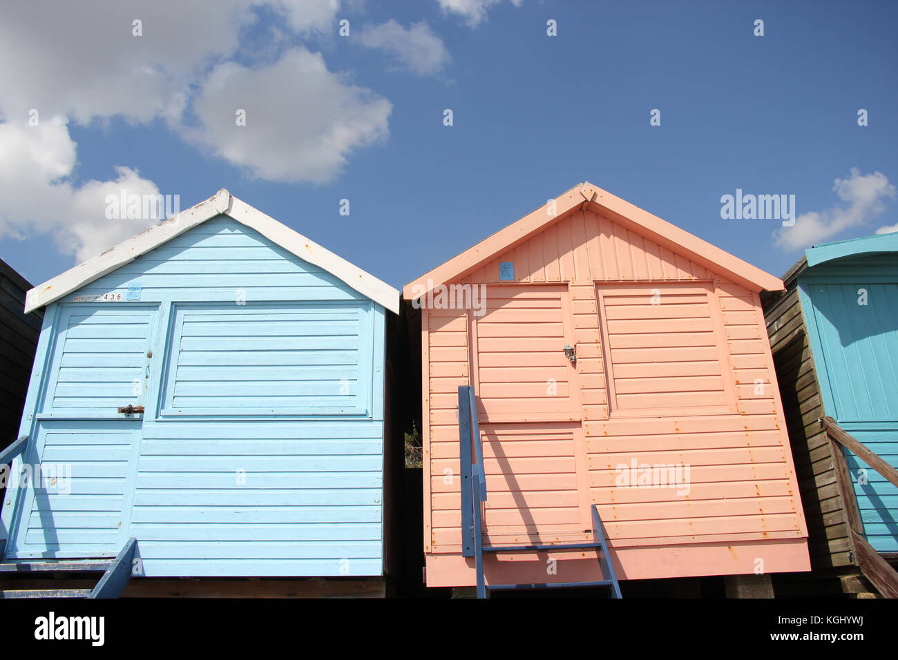 beach hut painted house paint on frinton beach Stock Photo - Alamy