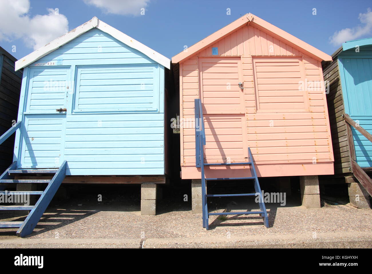 beach hut painted house paint on frinton beach Stock Photo - Alamy