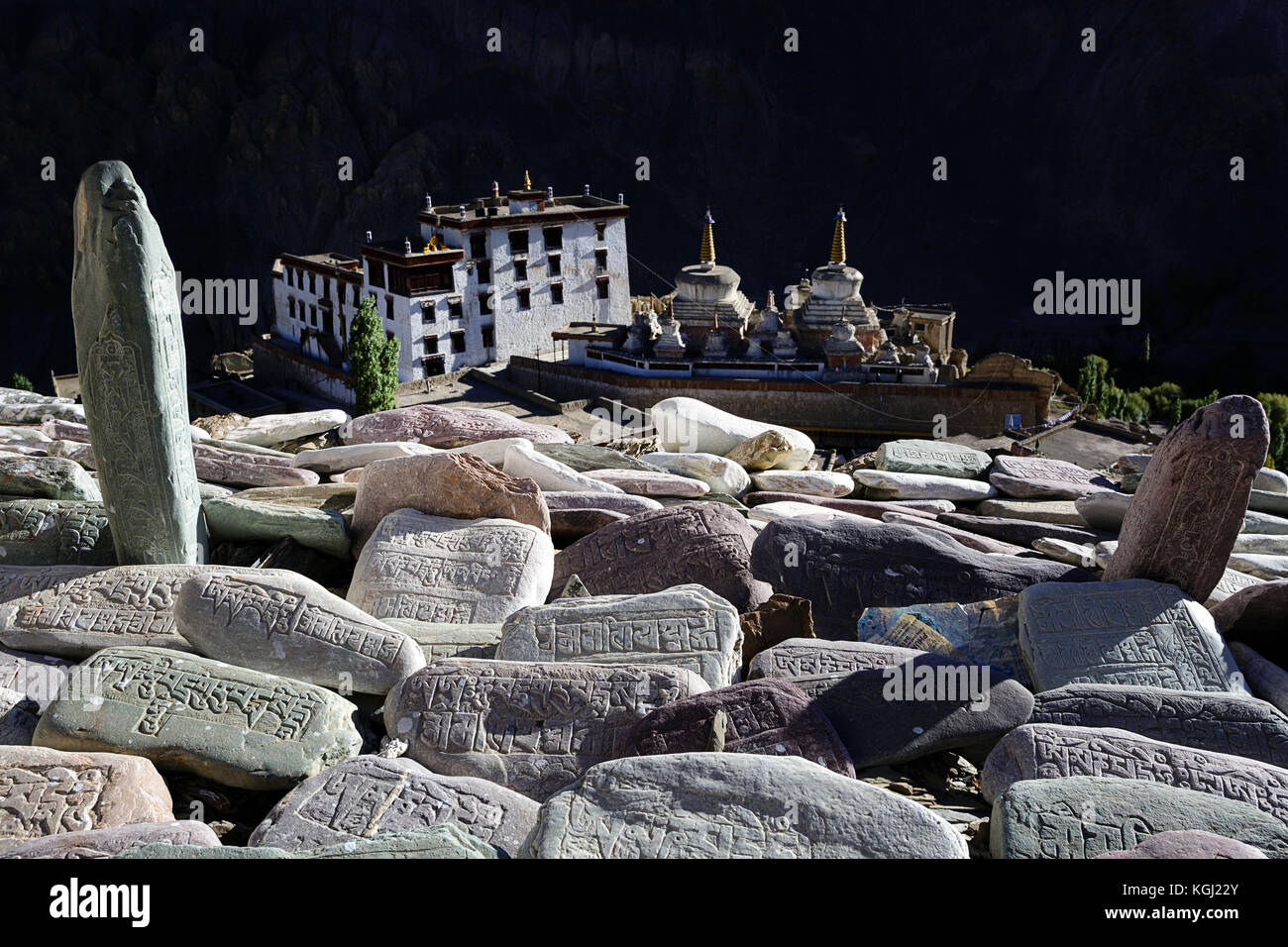Lamayuru monastery and praying stones illuminated by the sun and the ...