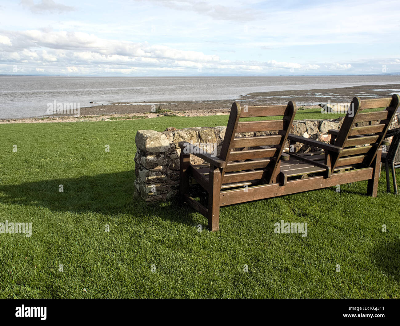 Bench on the shore Stock Photo - Alamy