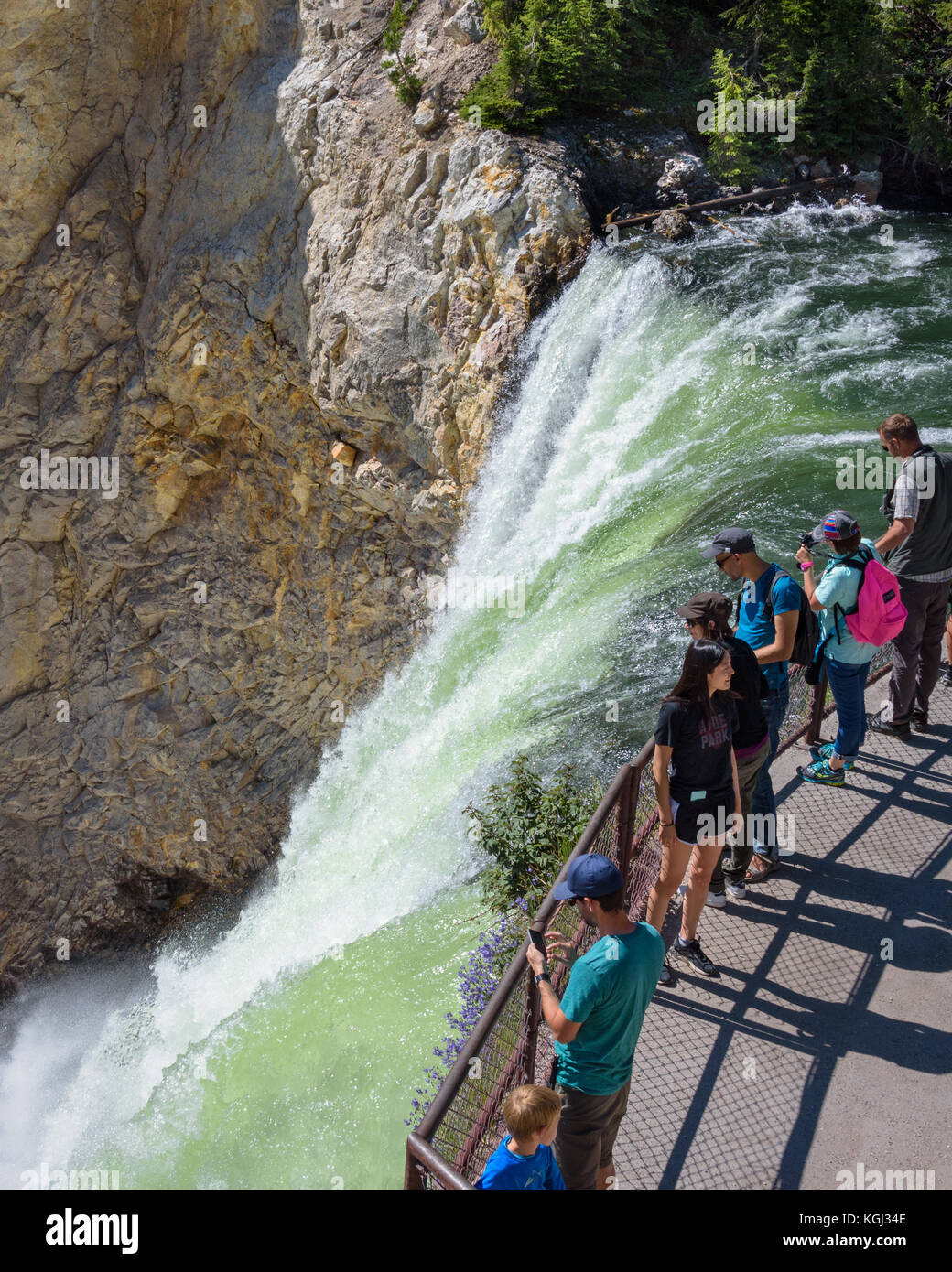 YELLOWSTONE NATIONAL PARK, WYOMING, USA - JULY 17, 2017: Tourists and a ...