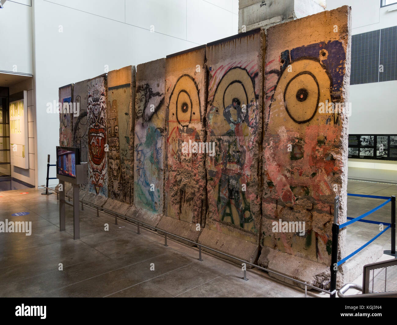 A large section of the Berlin Wall on display in Newseum, an ...