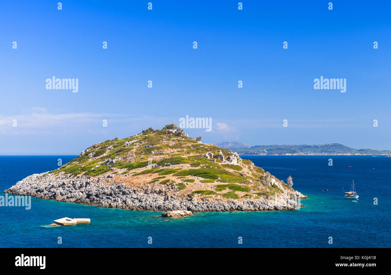 Vardiola St. Nicholas. Small isle with ruins in the bay of Agios ...