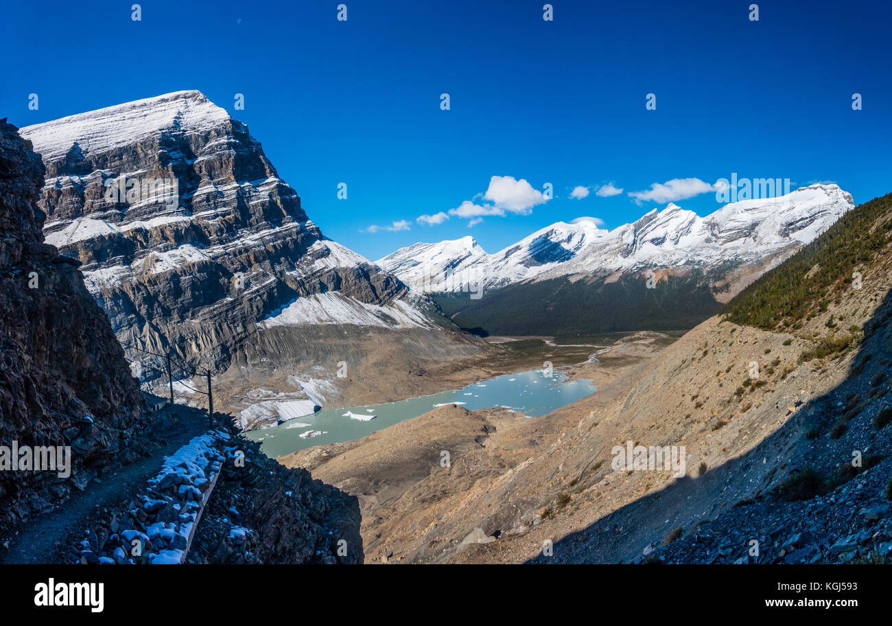 Alpine Hiking Trail with Handrail and views of Lake and Mountains Stock ...