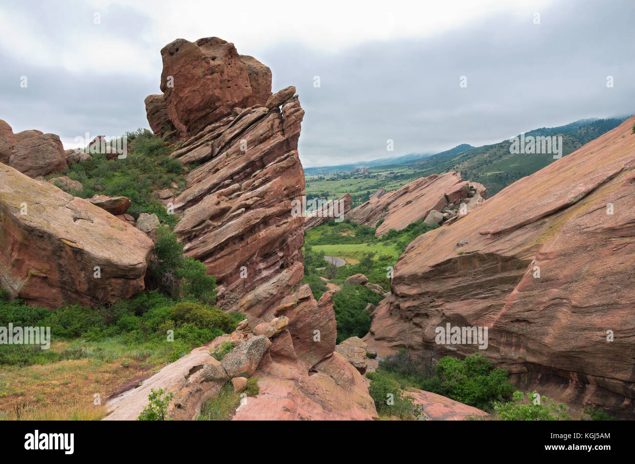 red sandstone rock formations and surrounding mountains of red rocks ...