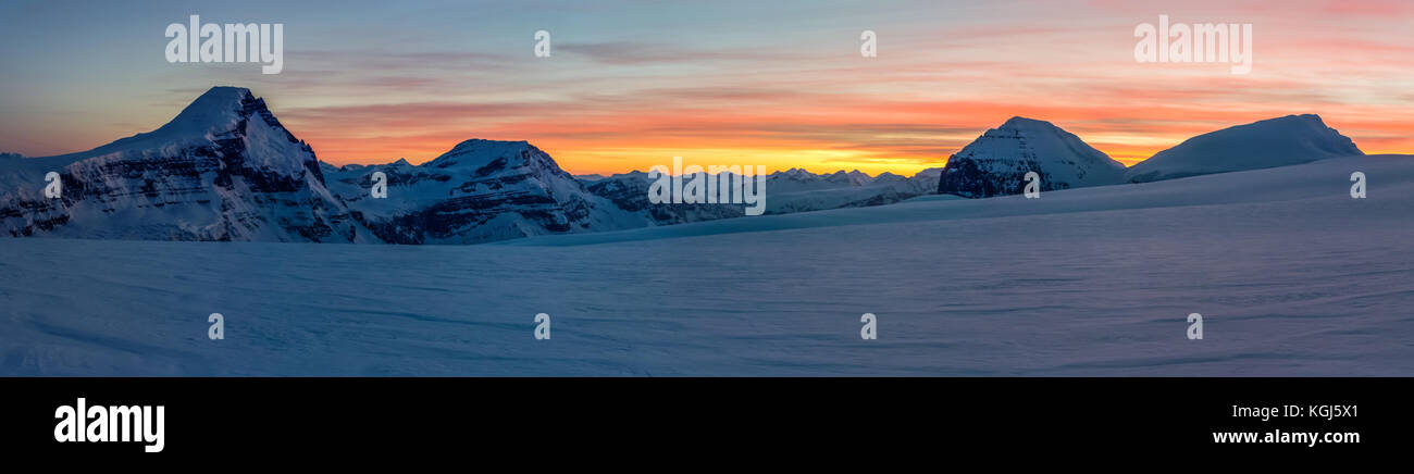 Snow Covered Mountains and Colorful Sunset Stock Photo - Alamy