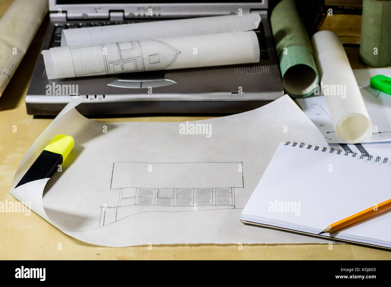 architect's table, laptop, calculator on the table. Plans, projects and ...