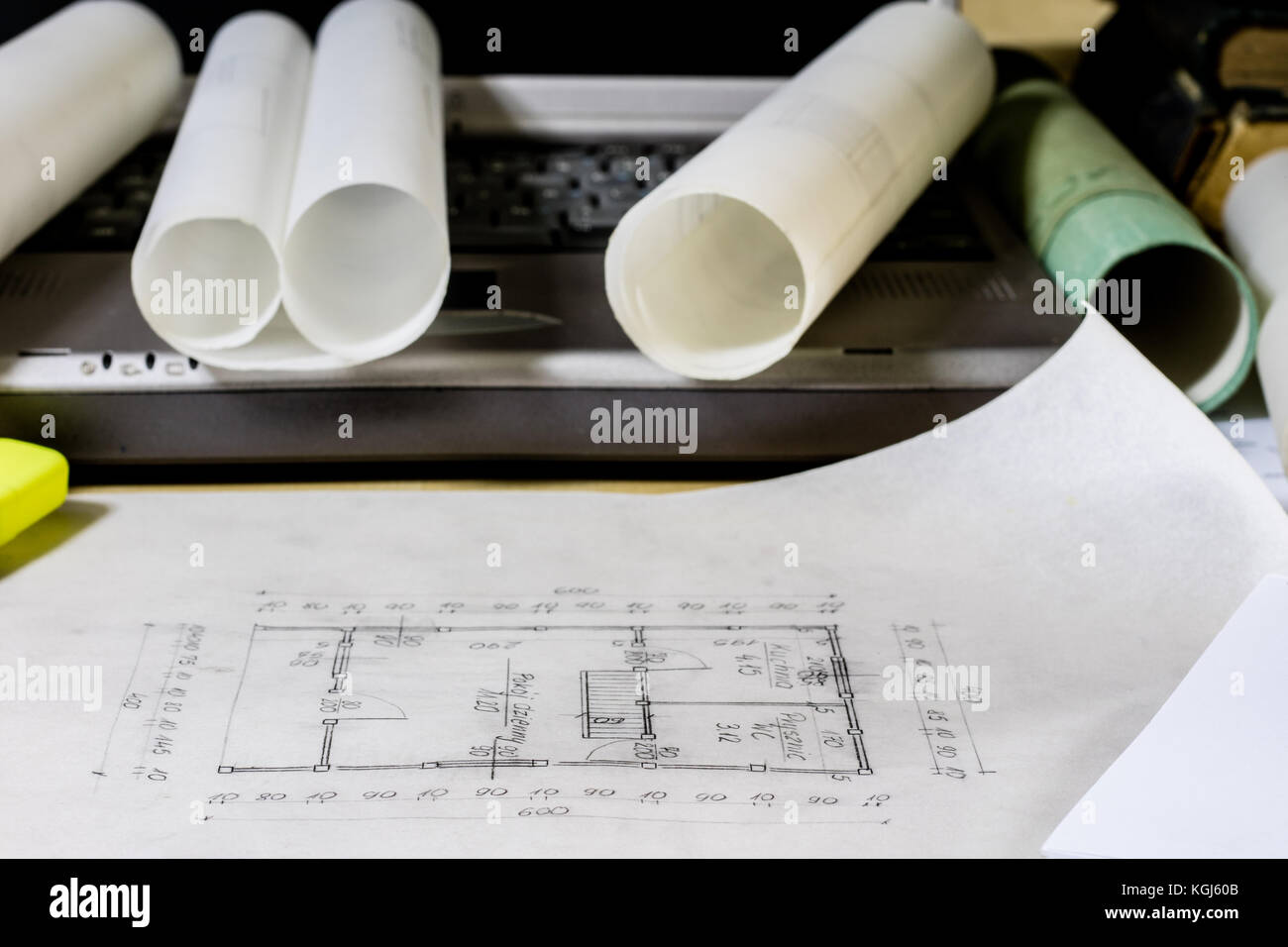architect's table, laptop, calculator on the table. Plans, projects and ...