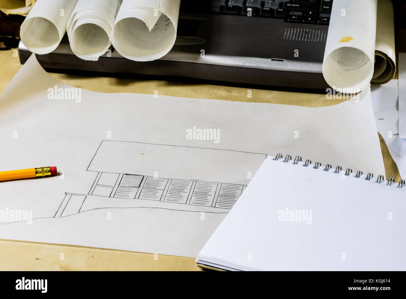 architect's table, laptop, calculator on the table. Plans, projects and ...