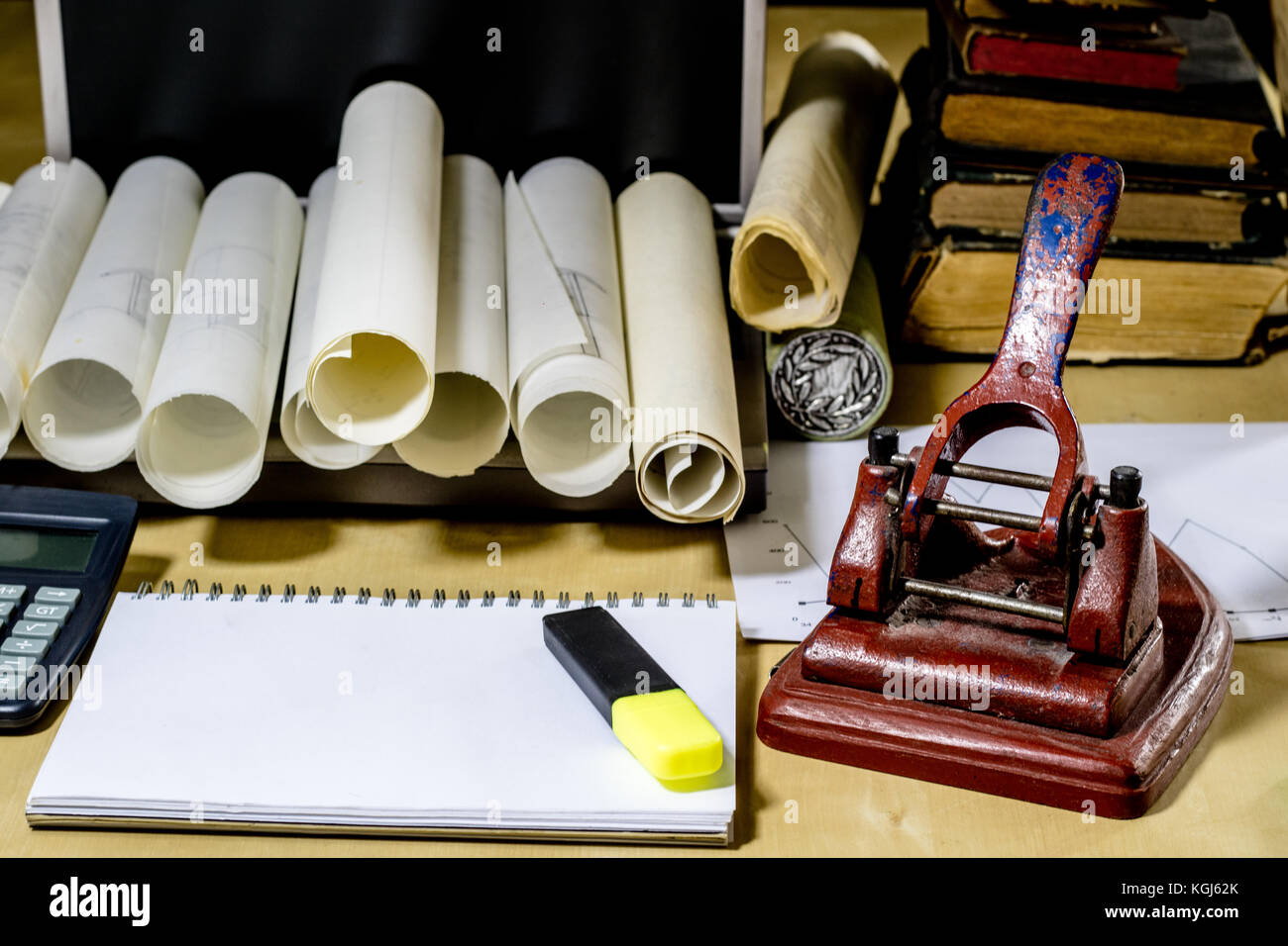 architect's table, laptop, calculator on the table. Plans, projects and ...