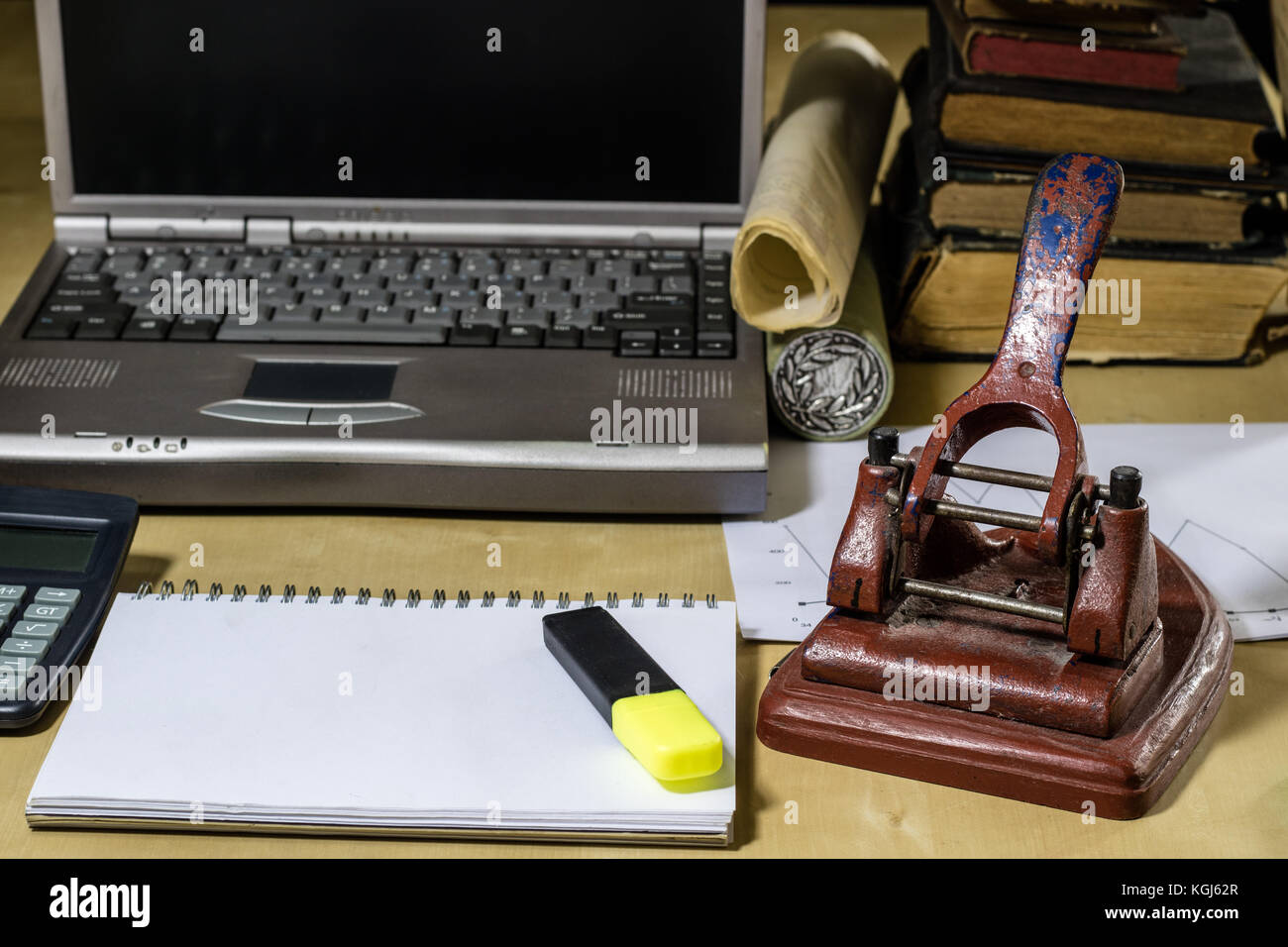 architect's table, laptop, calculator on the table. Plans, projects and ...