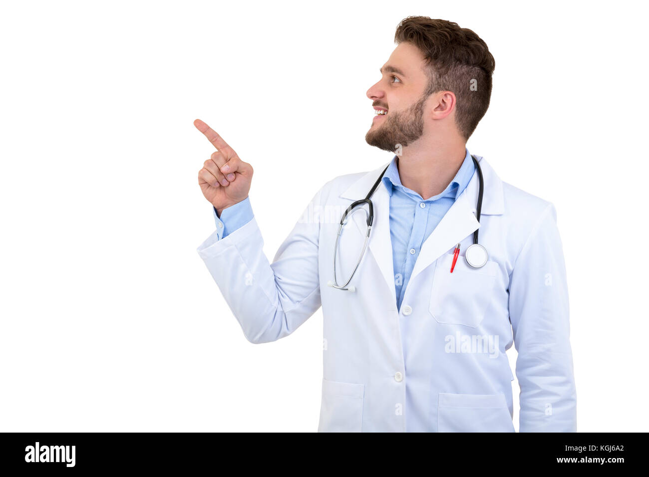 Portrait of a Young smiling male doctor pointing finger away isolated ...