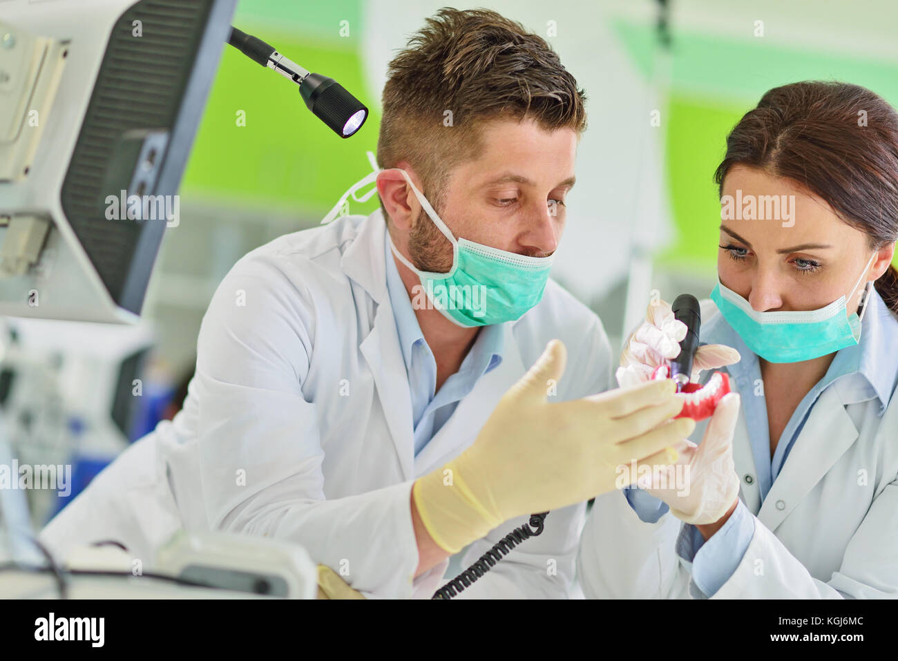 Dental prosthesis, dentures, prosthetics work. Prosthetics hands while ...