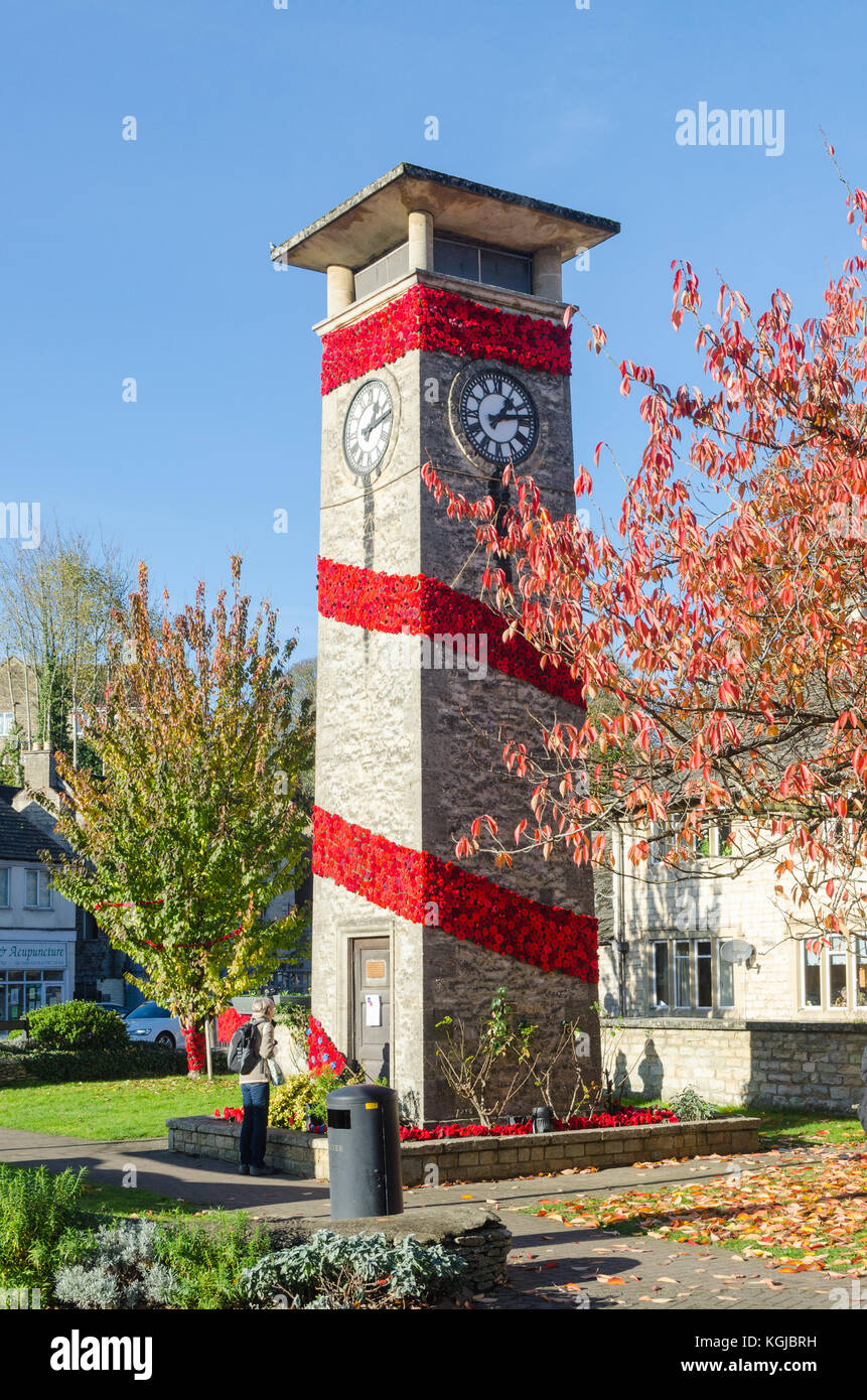 The clock tower war memorial in the centre of the Cotswold town of ...