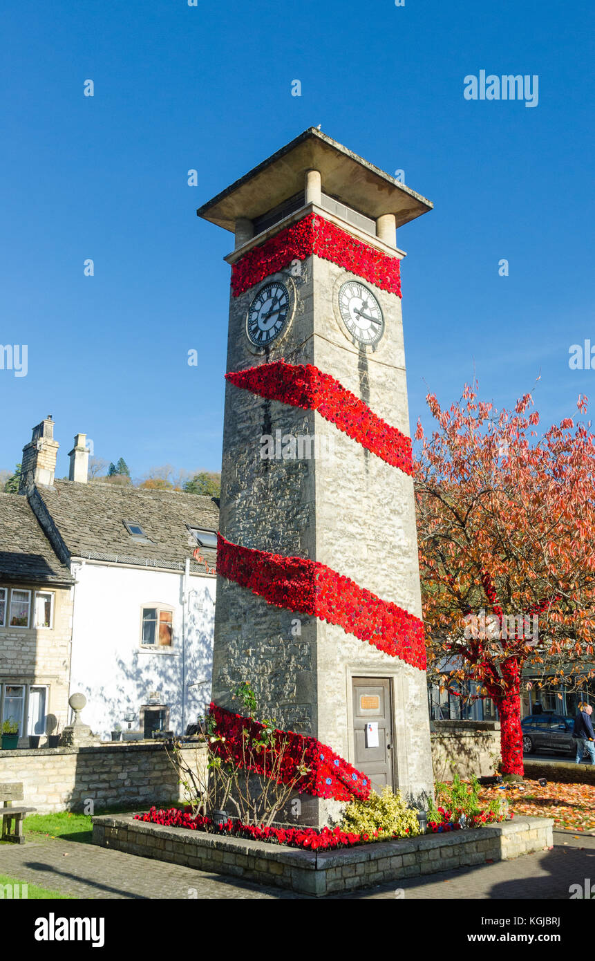 The clock tower war memorial in the centre of the Cotswold town of ...