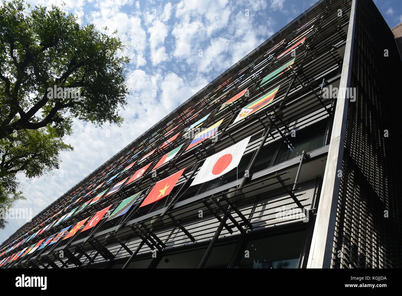 Palaceside Building in Chiyoda Ward, Tokyo, is decorated with flags of ...