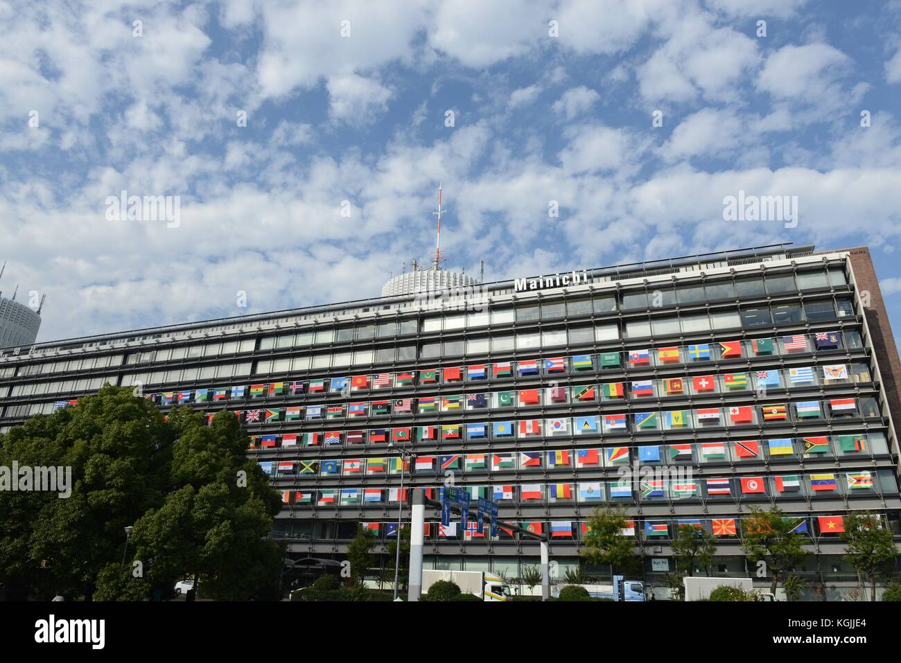 Palaceside Building in Chiyoda Ward, Tokyo, is decorated with flags of ...