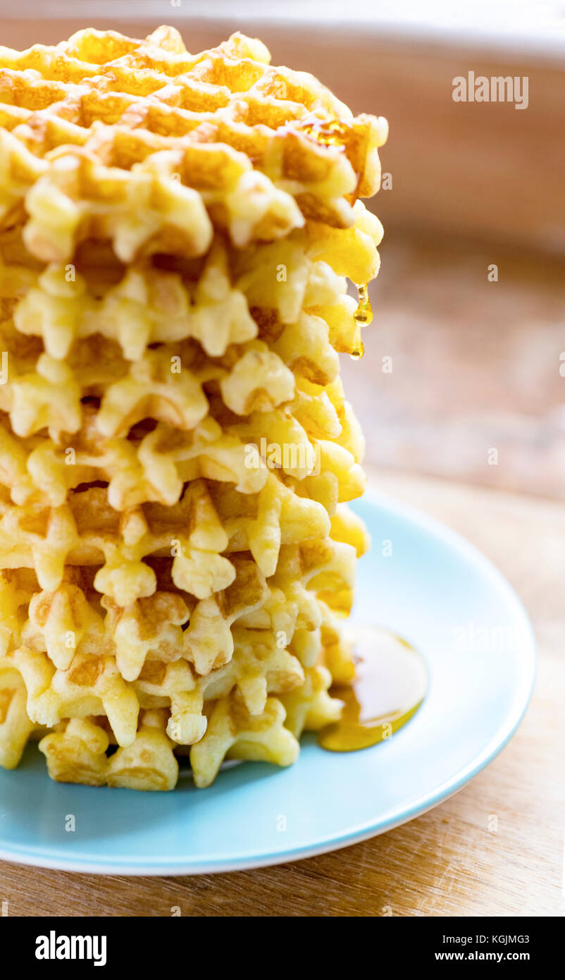 selective focus on a tall stack of Belgium waffles vertical side view ...