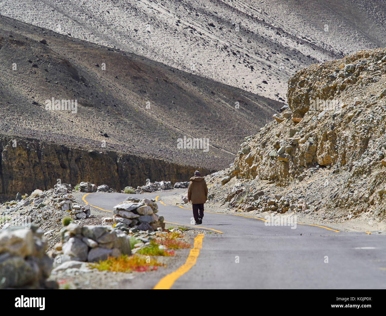 Man, a man leaves into the distance, a view from the back, along a ...