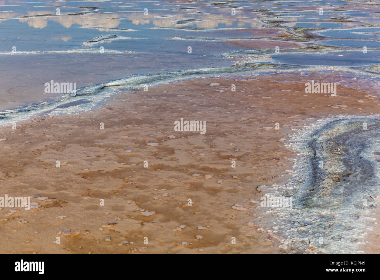 The crust of salt on the bottom of the curative mud dry lake. The ...