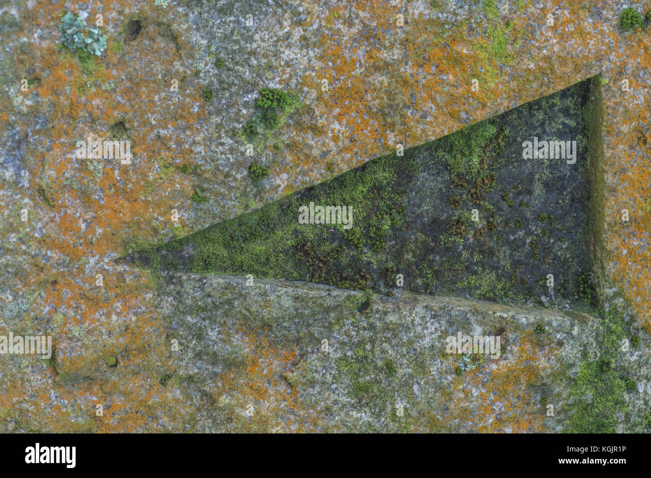 Directional arrow carved into a stone block on a country walk. Metaphor ...