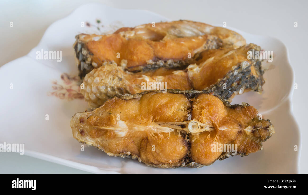 Crispy fish pieces, close up seafood dish Stock Photo - Alamy