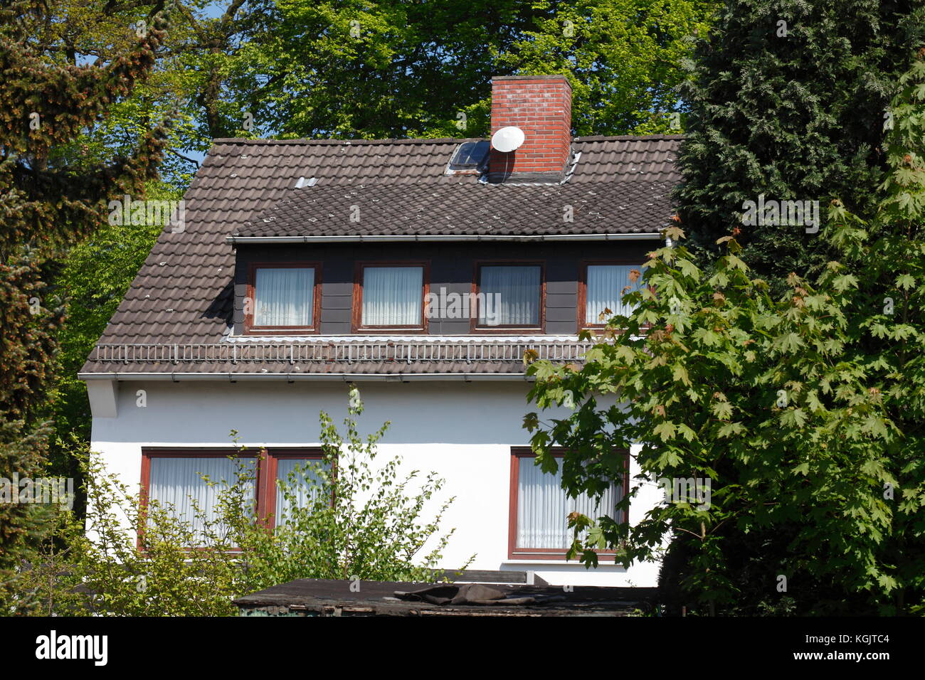 Residential House with green trees Stock Photo - Alamy