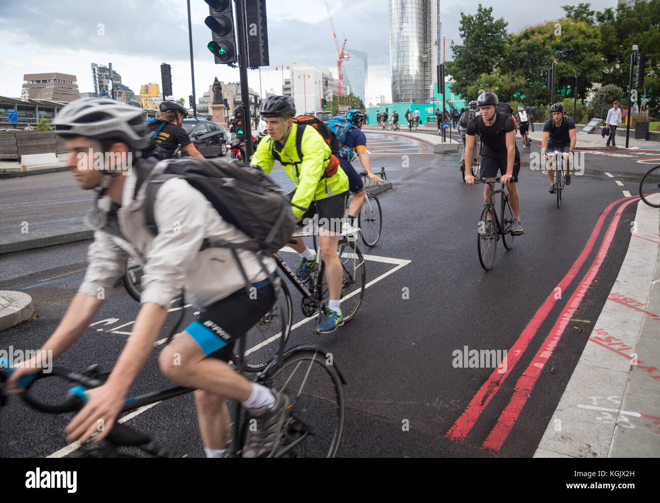 Rush-hour commuting yclists cycling on North-South cycle Superhighway ...