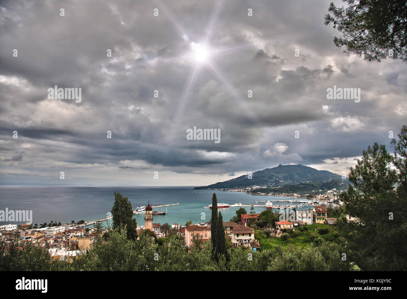 stuning landscape of a greek island with cloudy sky and sun with star ...