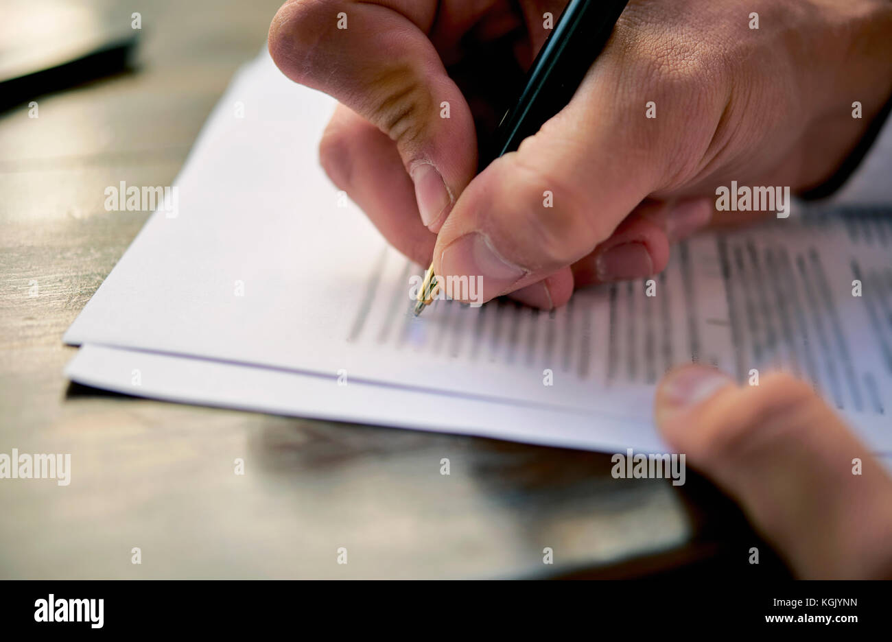 man signs a contract Stock Photo - Alamy