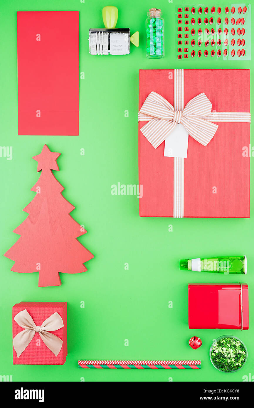Festive Christmas mockup on a green background of red objects and ...