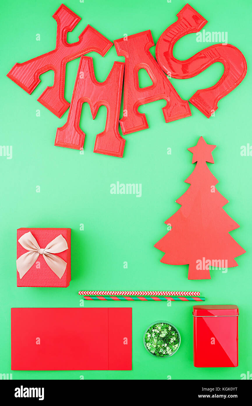Festive Christmas mockup on a green background of red objects and ...