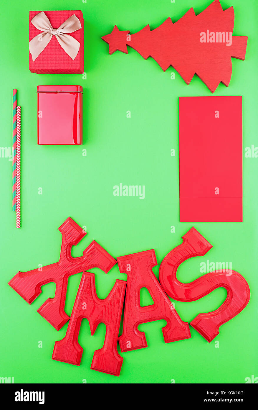 Festive Christmas mockup on a green background of red objects and ...