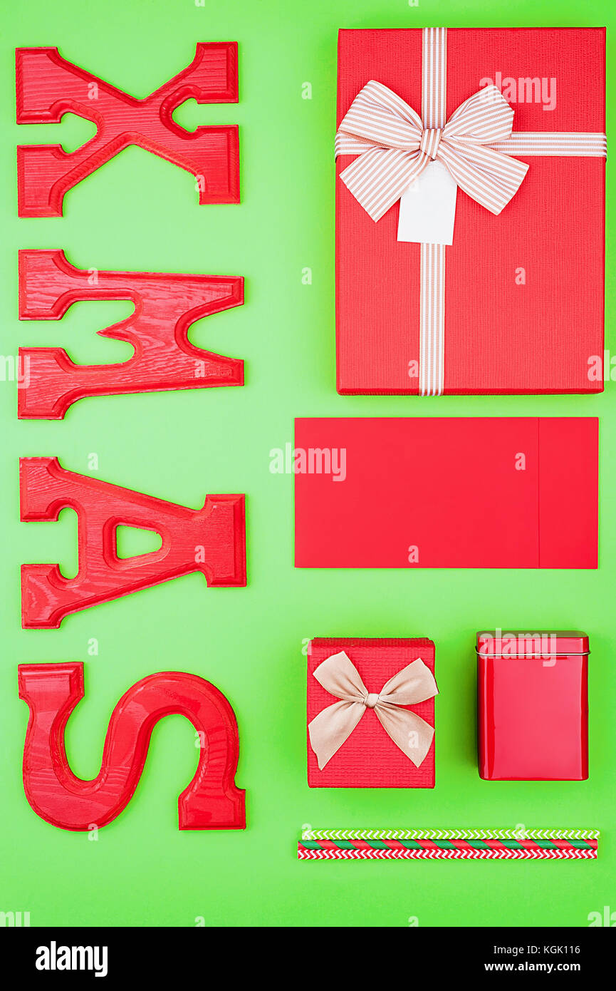 Festive Christmas mockup on a green background of red objects and ...