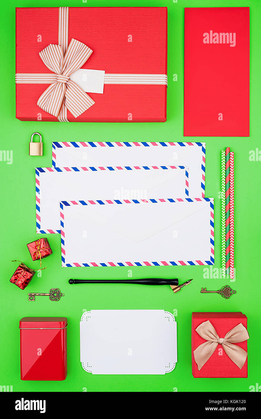Festive Christmas mockup on a green background of red objects and ...