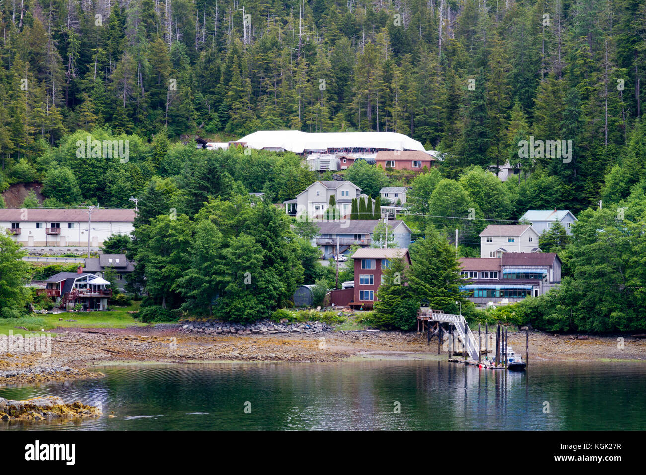 Houses and buildings clustered on a forested shore in Sitka, Alaska ...