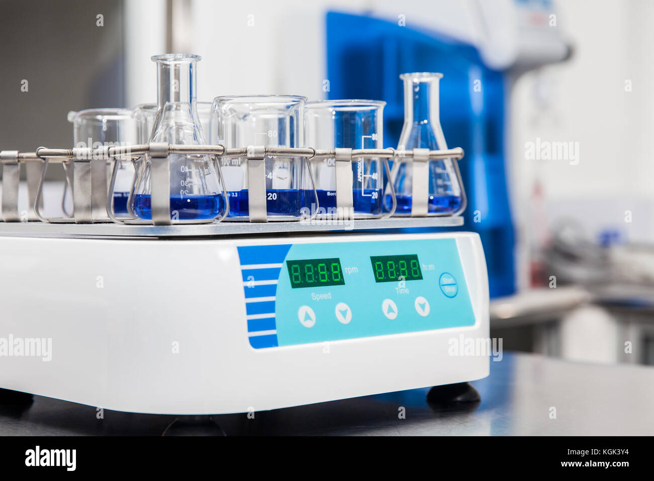 Laboratory shaker loaded with erlenmeyers and beakers Stock Photo - Alamy