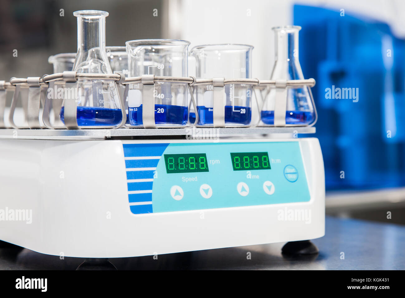Laboratory shaker loaded with erlenmeyers and beakers Stock Photo - Alamy