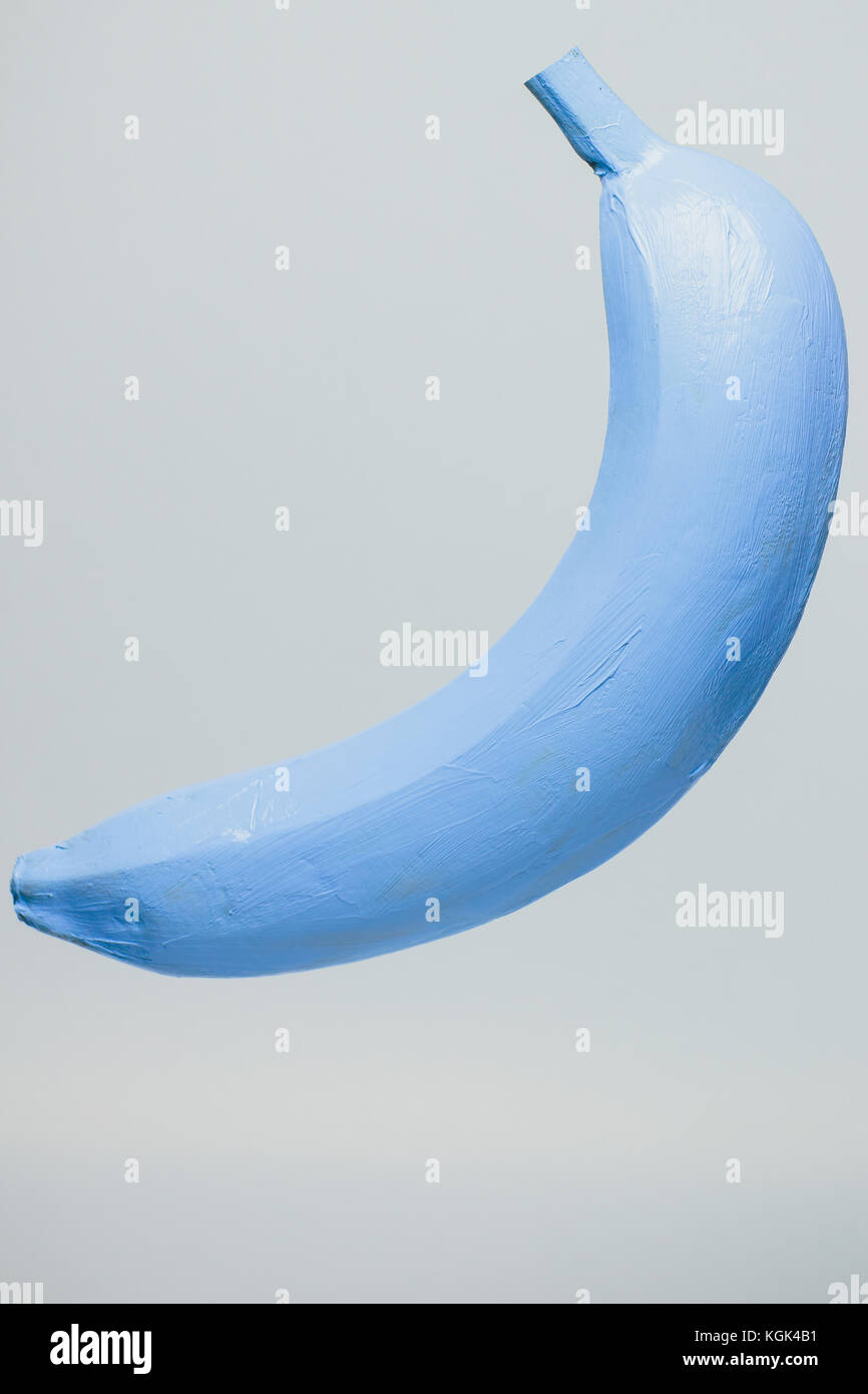 Blue banana on white background Stock Photo - Alamy