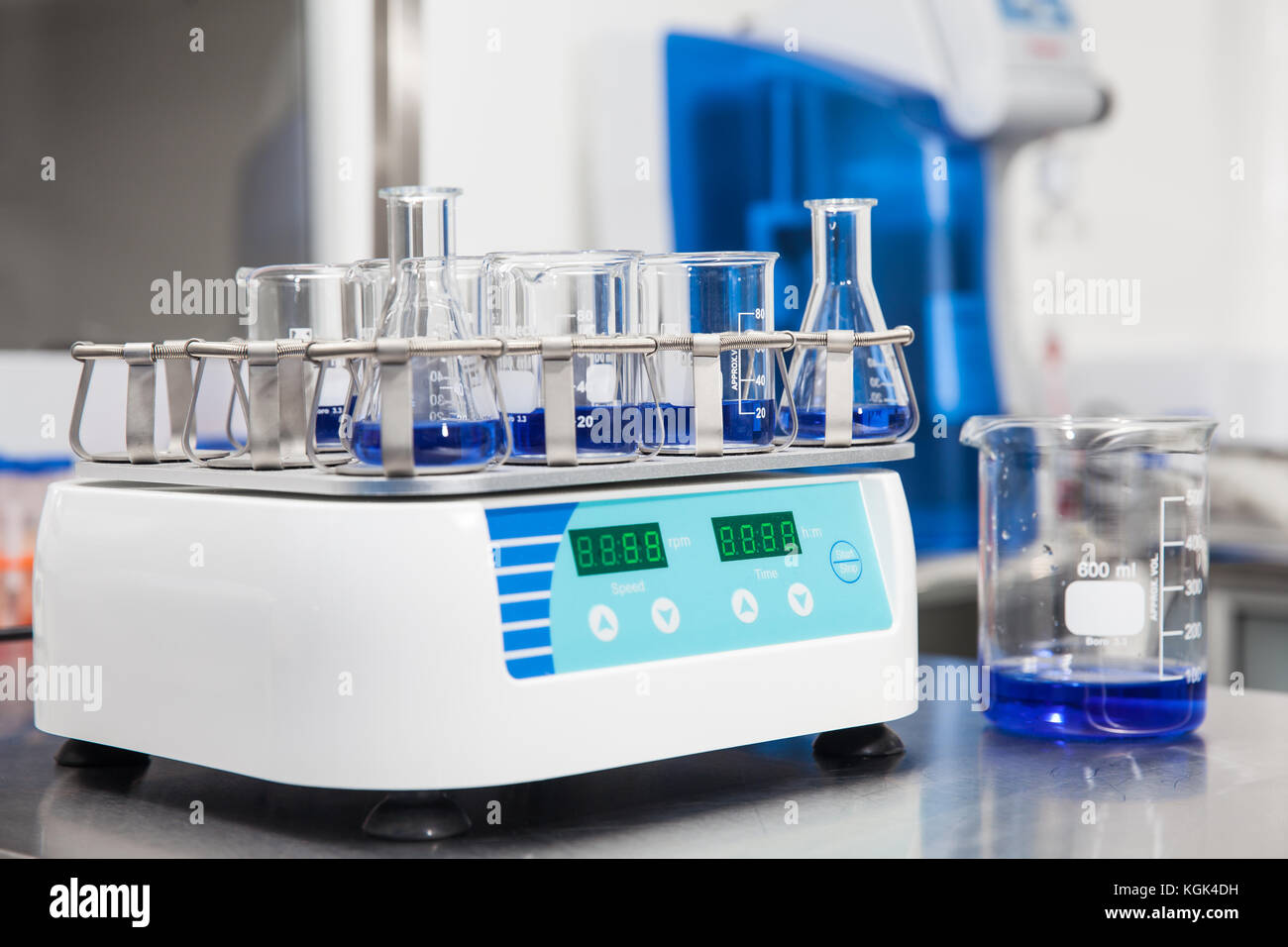 Laboratory shaker loaded with erlenmeyers and beakers Stock Photo - Alamy